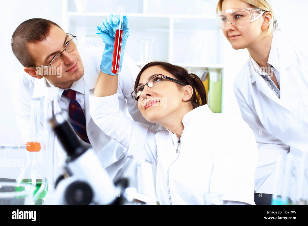 Scientist in uniform doing tests in laboratory Stock Photo - Alamy