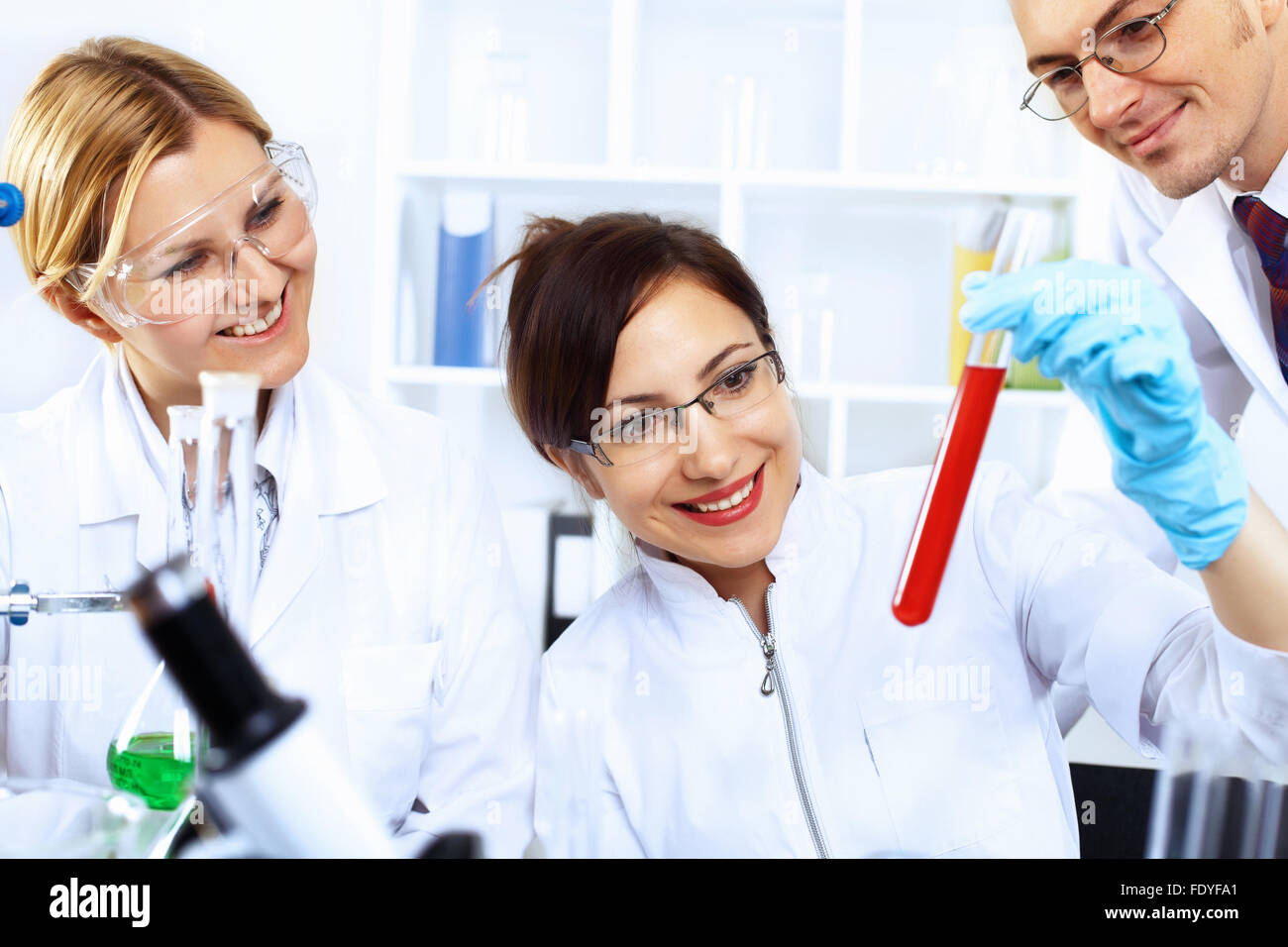 Scientist in uniform doing tests in laboratory Stock Photo - Alamy