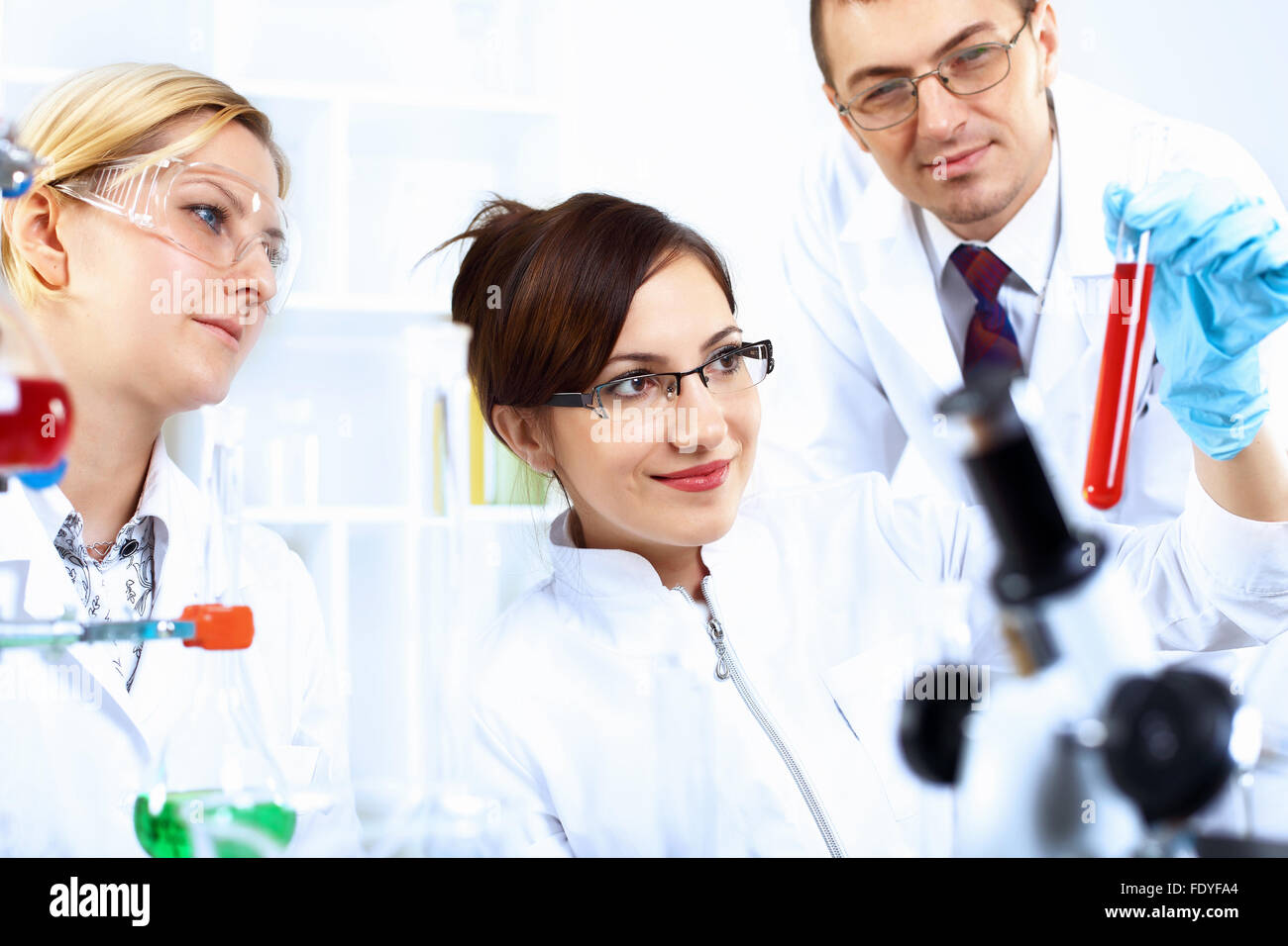 Scientist in uniform doing tests in laboratory Stock Photo - Alamy