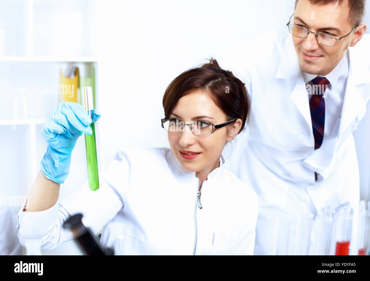 Scientist in uniform doing tests in laboratory Stock Photo - Alamy
