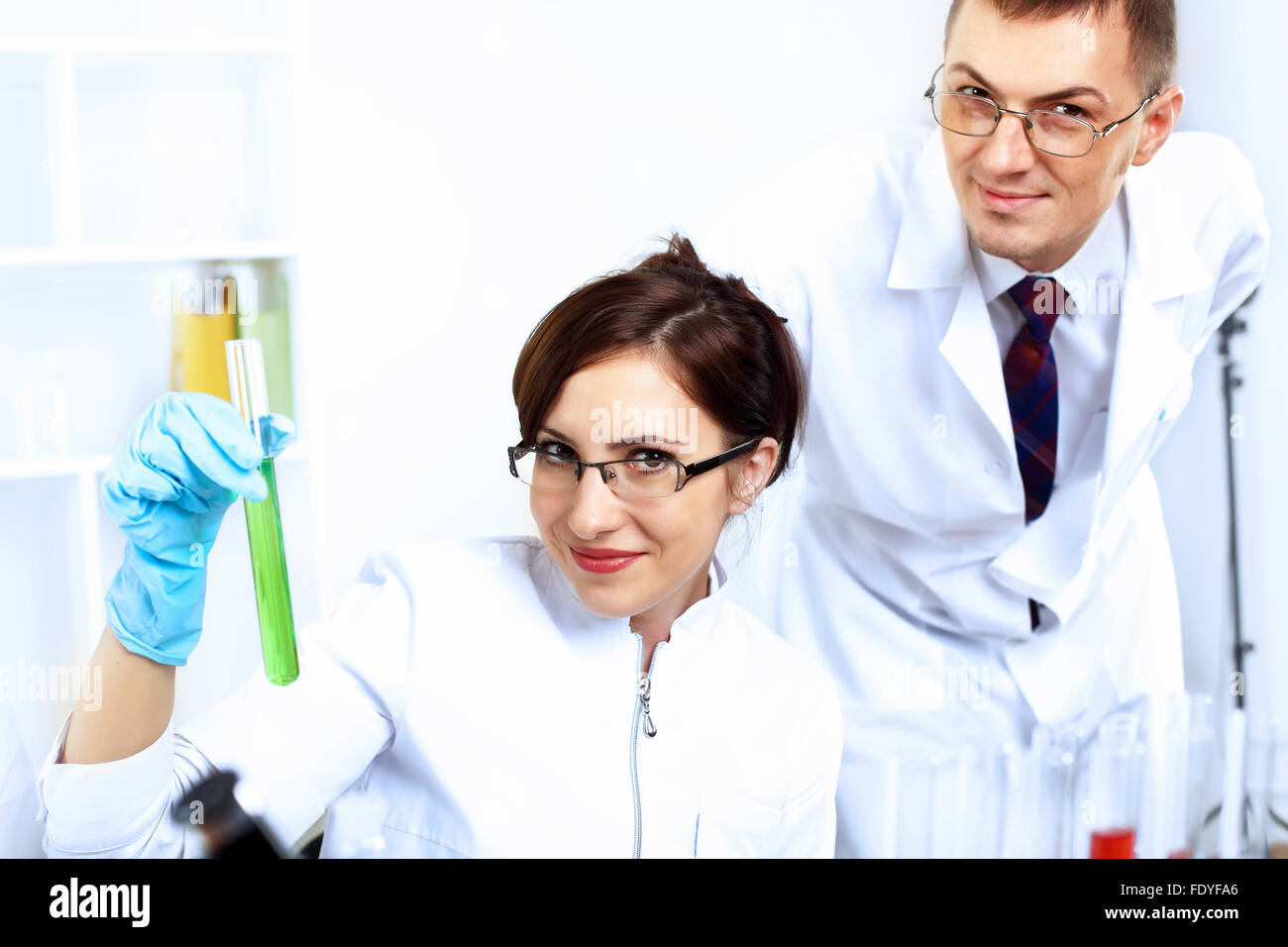 Scientist in uniform doing tests in laboratory Stock Photo - Alamy