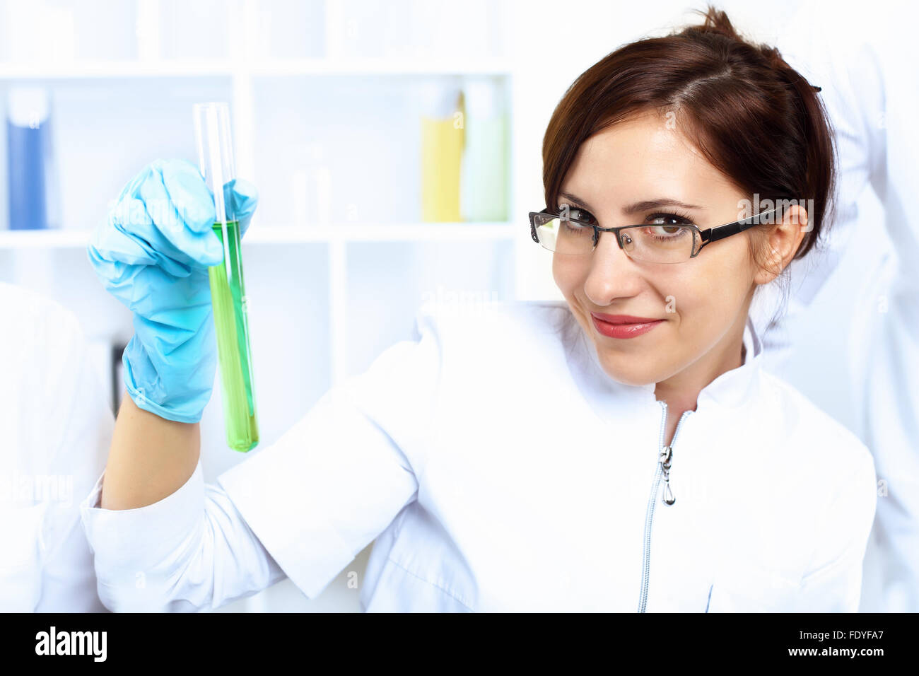Scientist in uniform doing tests in laboratory Stock Photo - Alamy
