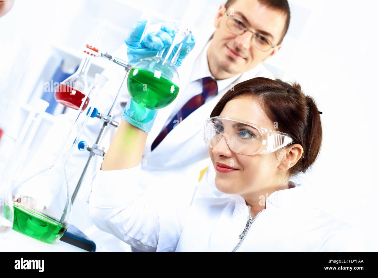 Scientist in uniform doing tests in laboratory Stock Photo - Alamy