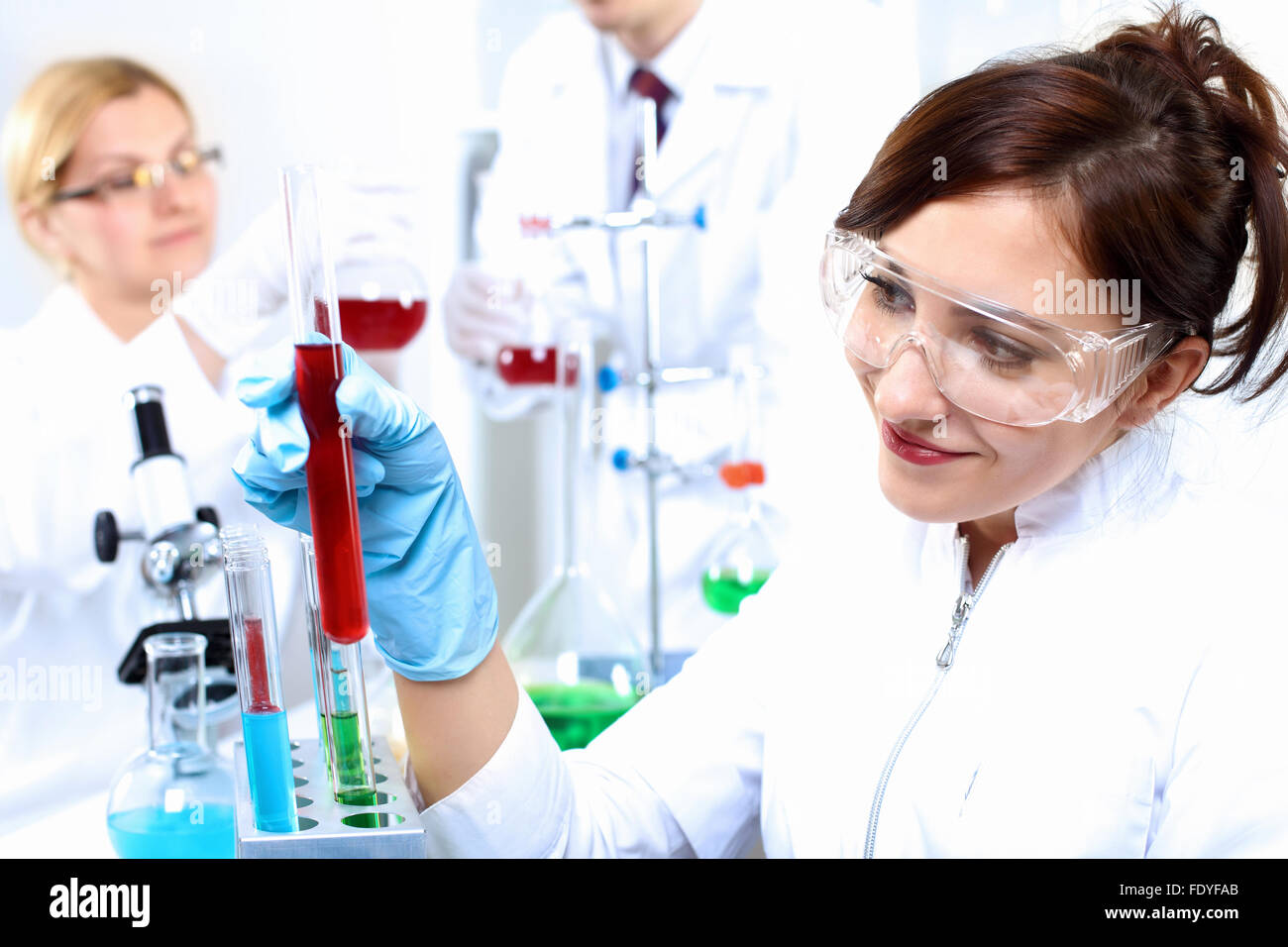 Scientist in uniform doing tests in laboratory Stock Photo - Alamy