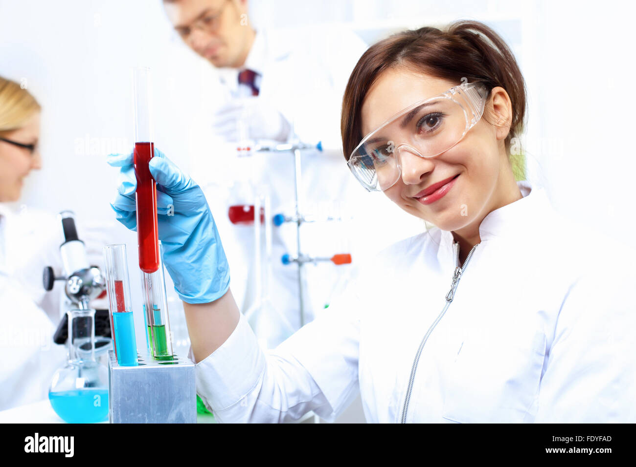 Scientist in uniform doing tests in laboratory Stock Photo - Alamy