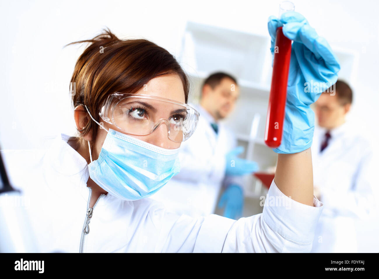 Scientist in uniform doing tests in laboratory Stock Photo - Alamy