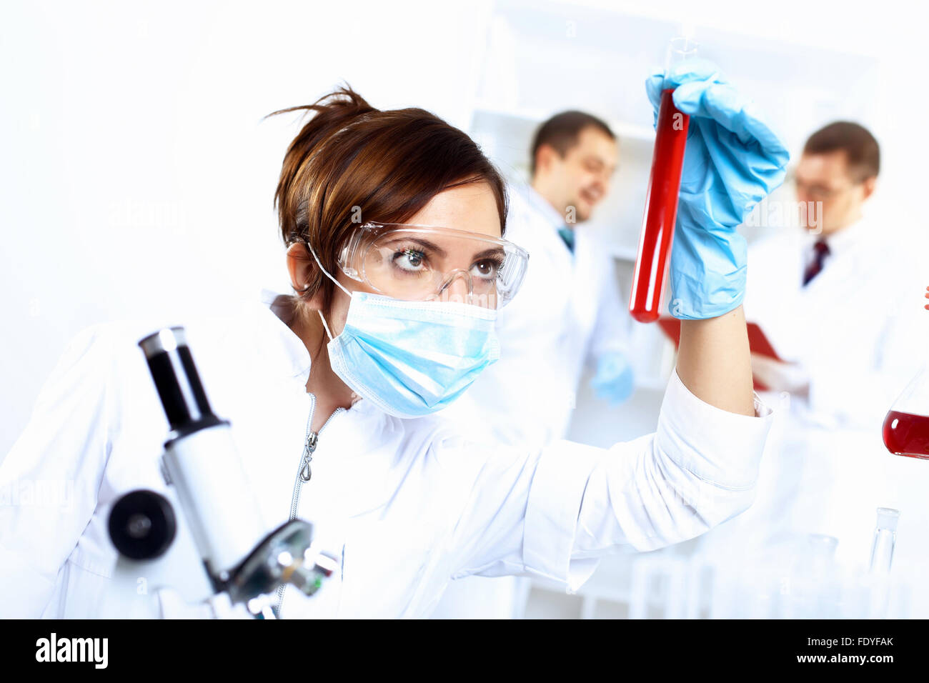 Scientist in uniform doing tests in laboratory Stock Photo - Alamy