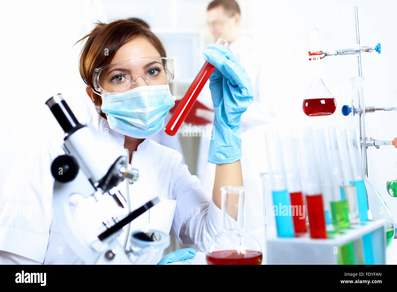 Scientist in uniform doing tests in laboratory Stock Photo - Alamy