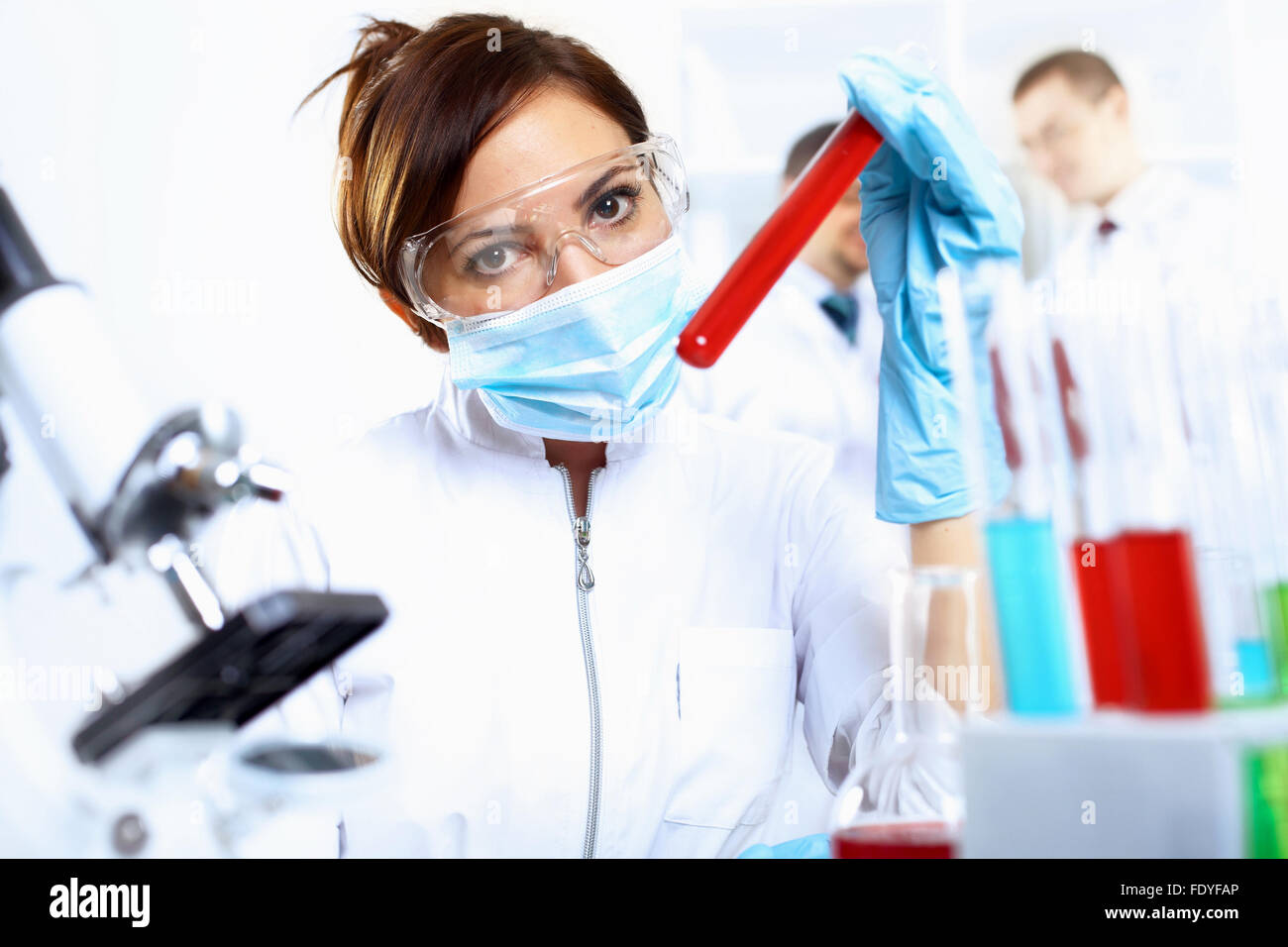 Scientist in uniform doing tests in laboratory Stock Photo - Alamy