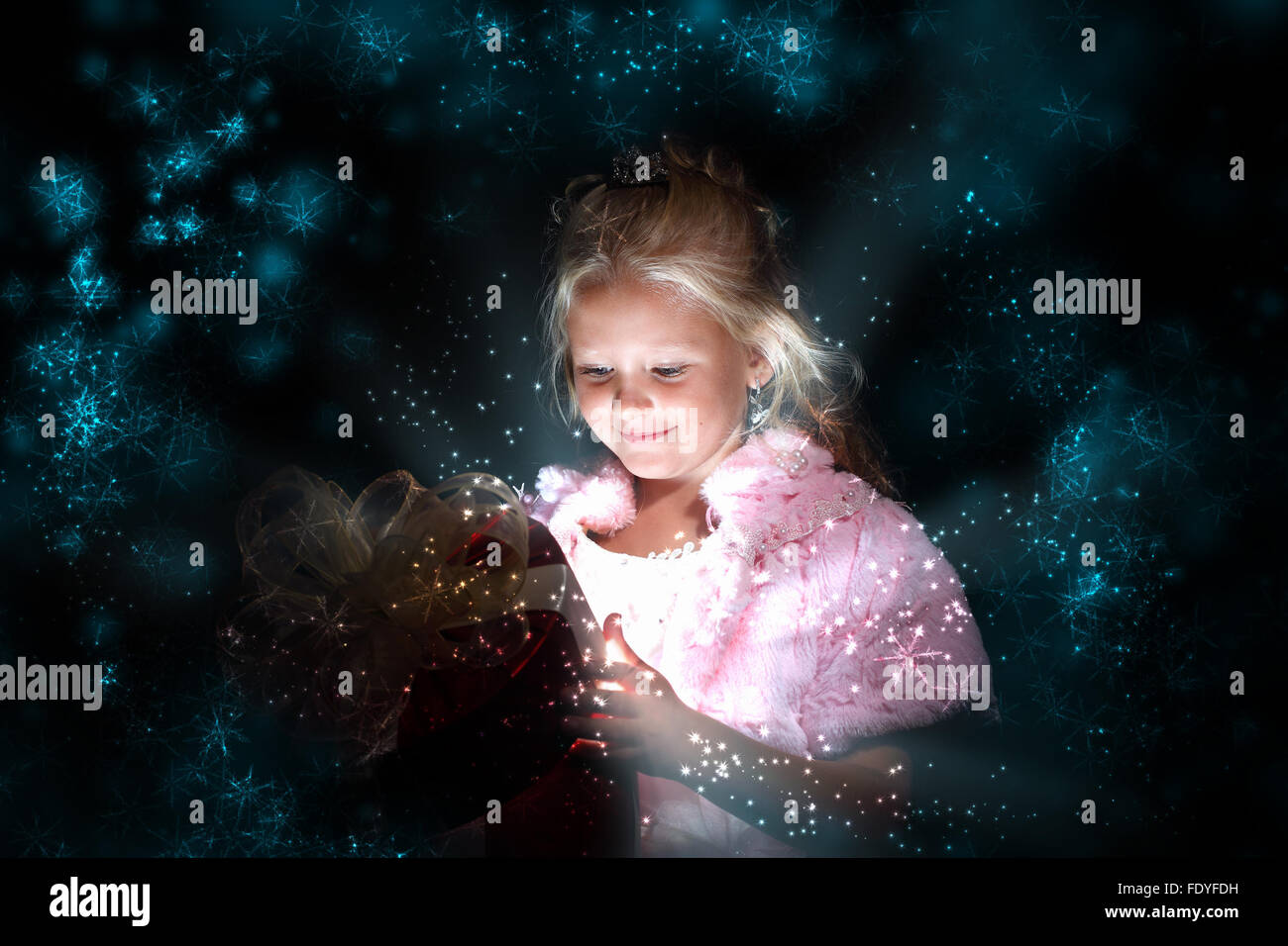 Child opening a magic gift box with lights and shining around Stock ...