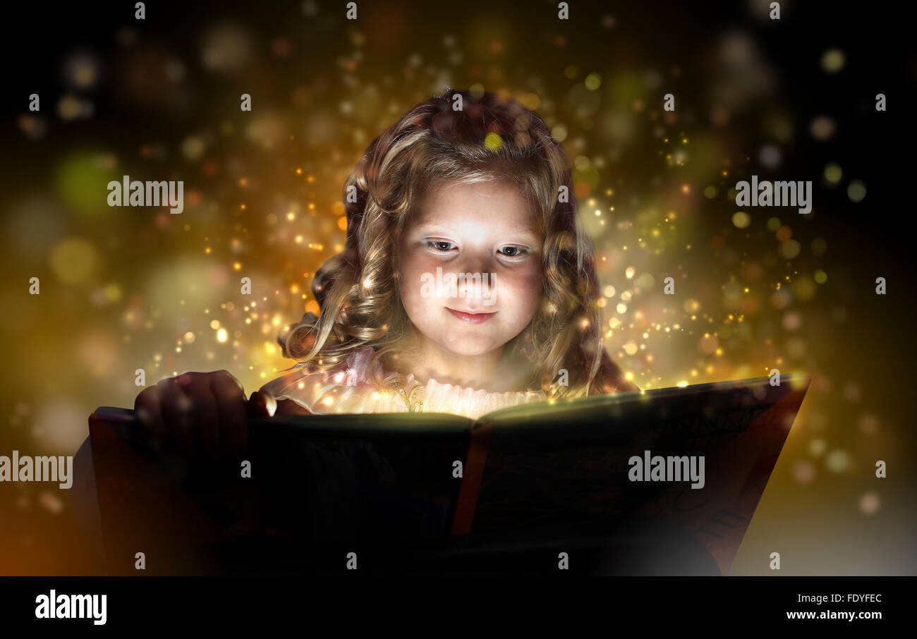 Child opening a magic gift box with lights and shining around Stock ...