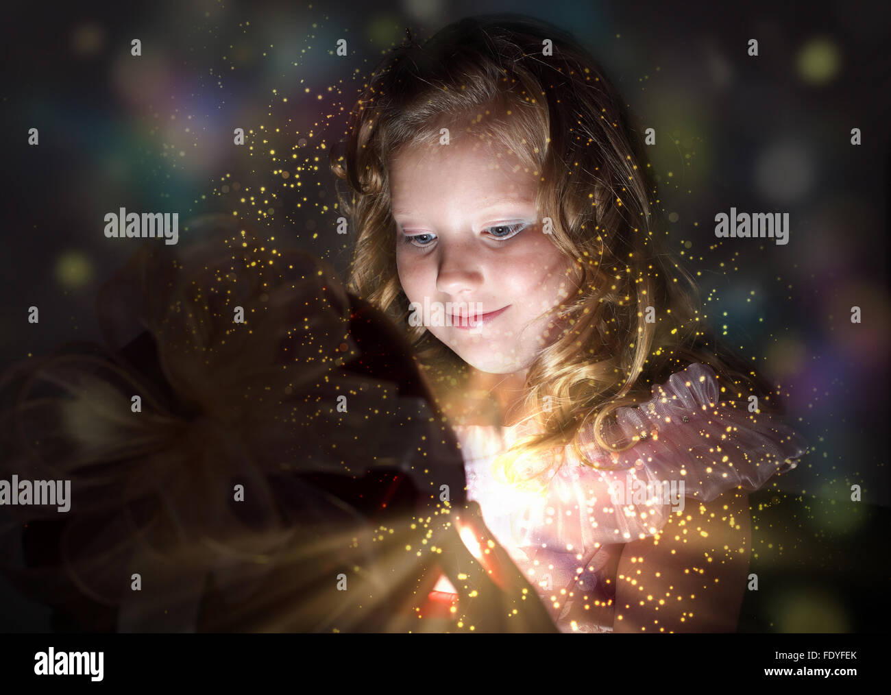Child opening a magic gift box with lights and shining around Stock ...