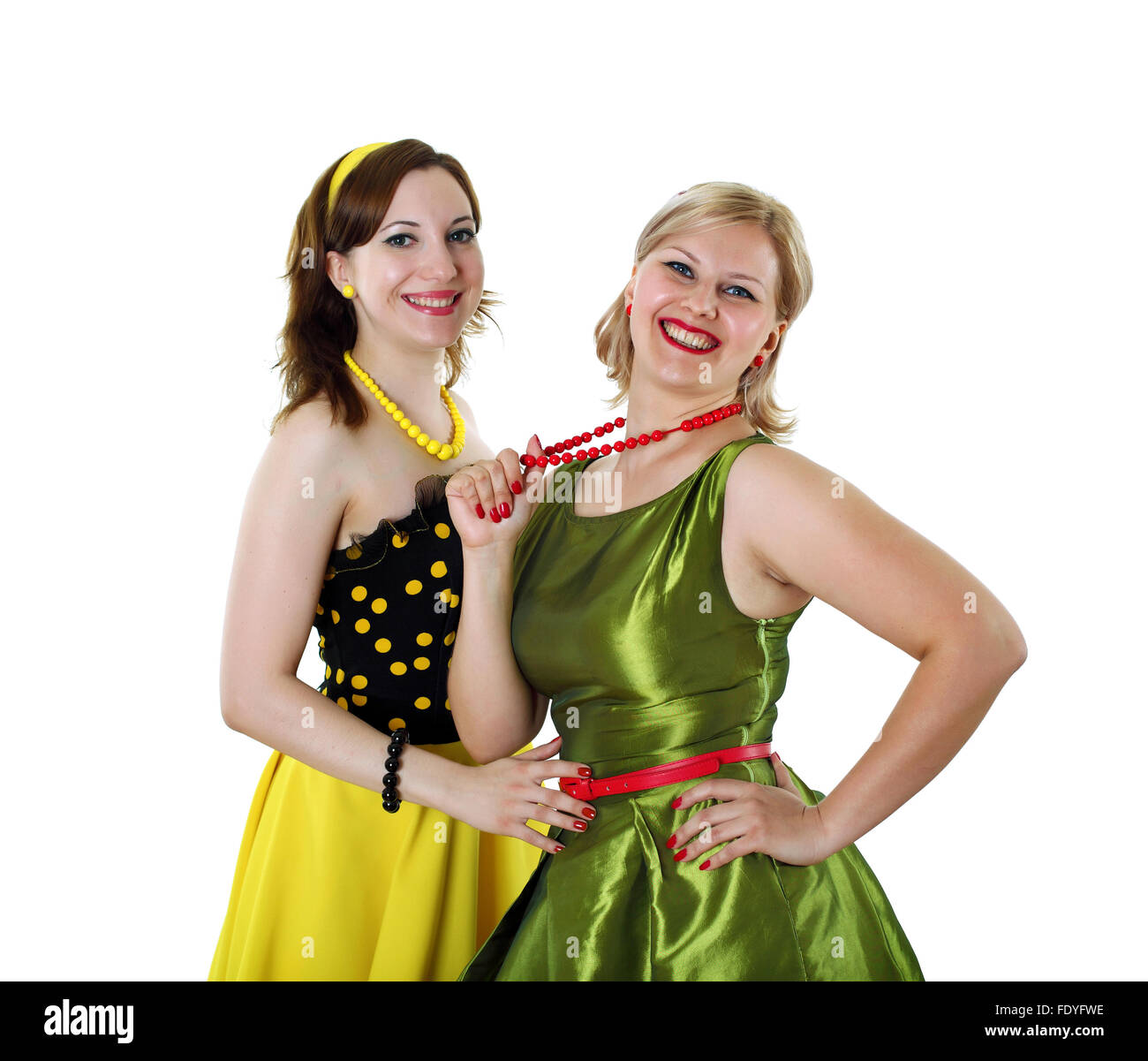 two stylish young woman in bright colour dresses Stock Photo - Alamy
