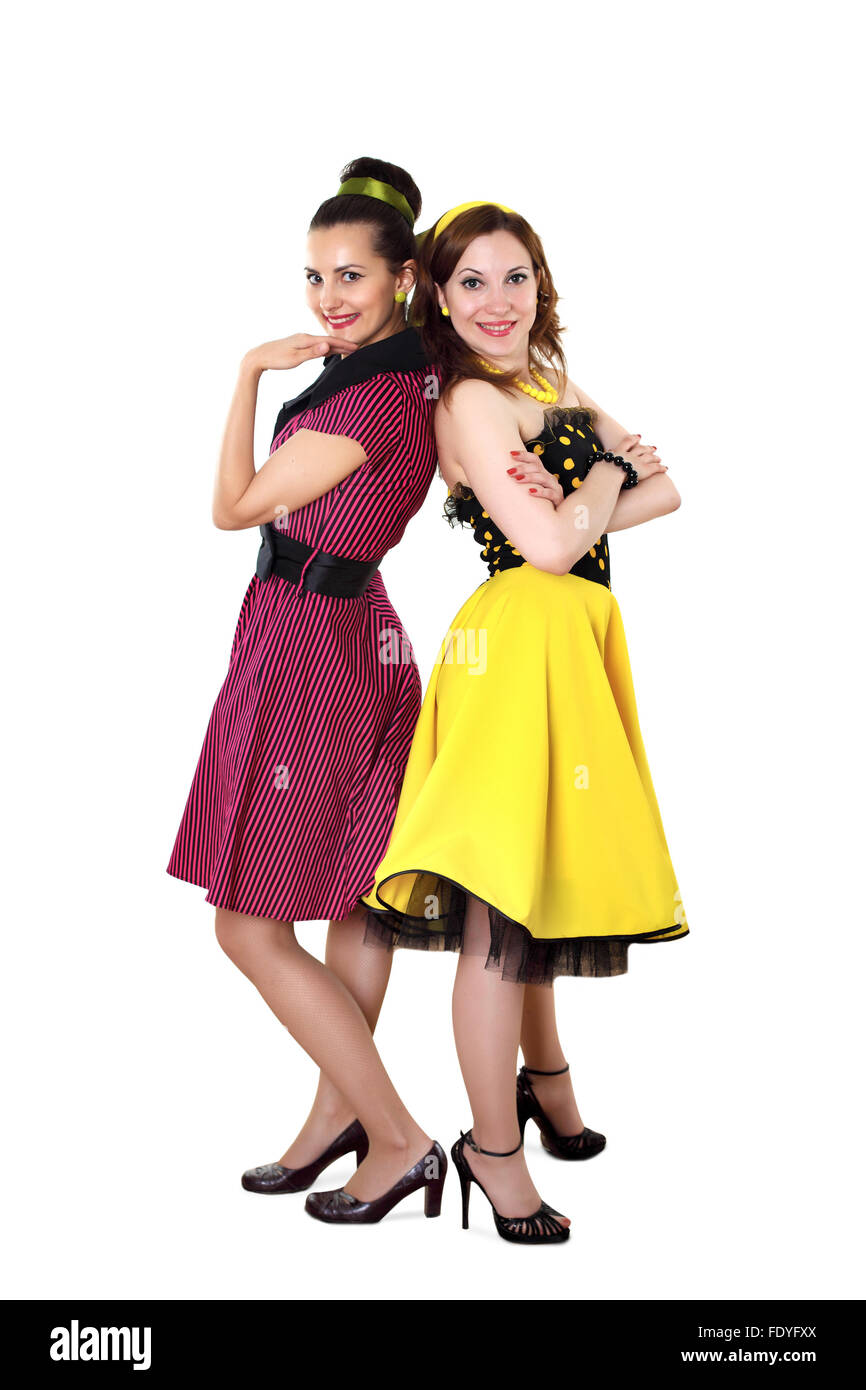 two stylish young woman in bright colour dresses Stock Photo - Alamy