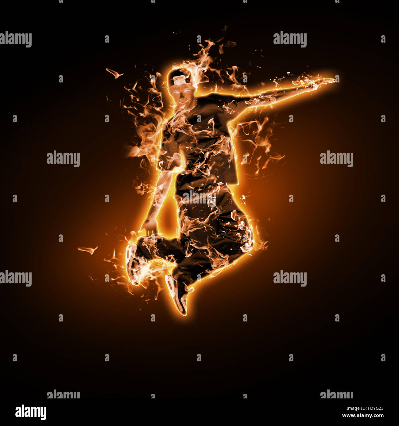 Flame and fire dancer against black background Stock Photo - Alamy