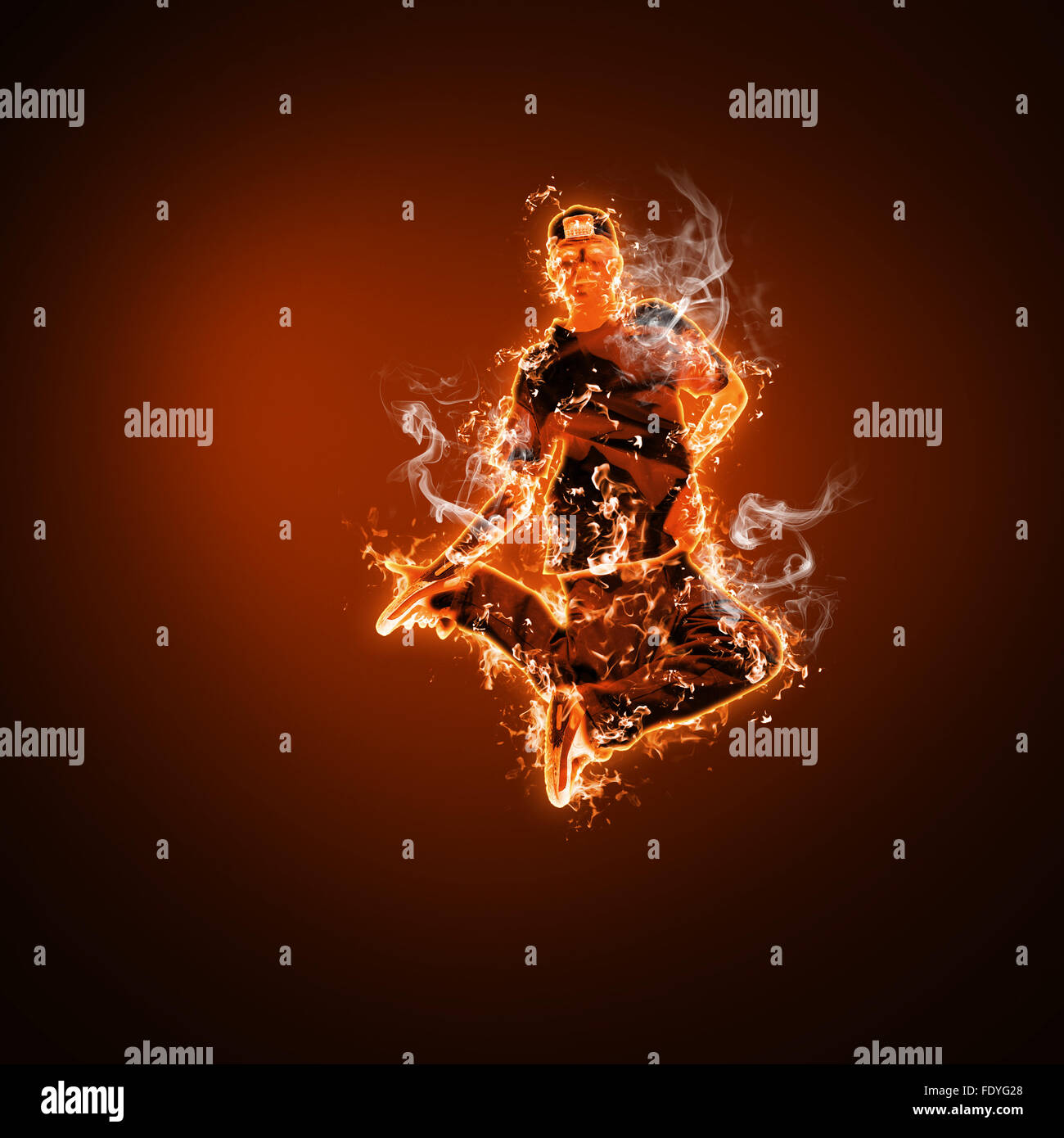Flame and fire dancer against black background Stock Photo - Alamy