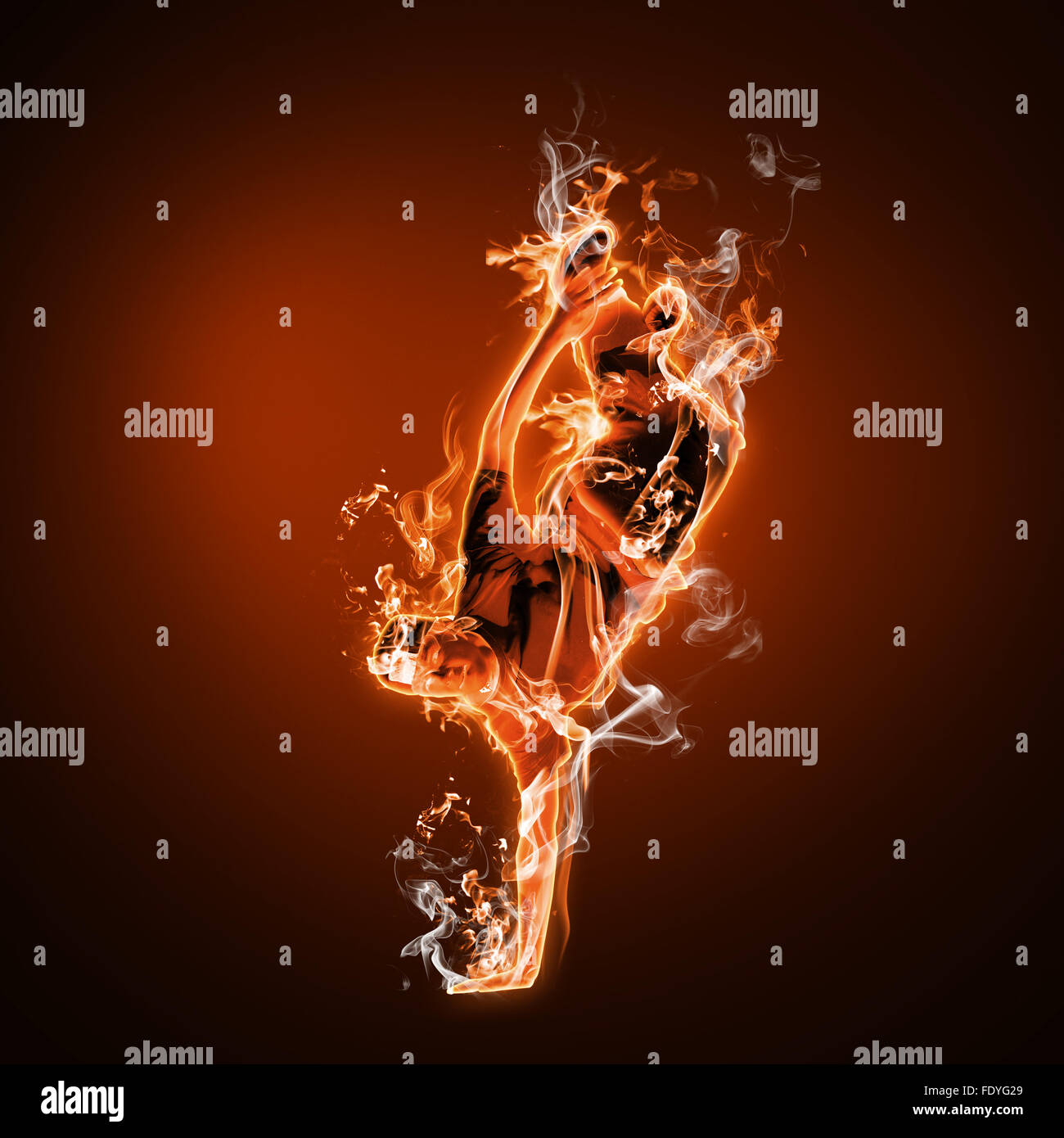 Flame and fire dancer against black background Stock Photo - Alamy