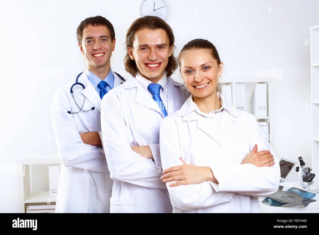 Group of doctors in uniforms together in clinic Stock Photo - Alamy