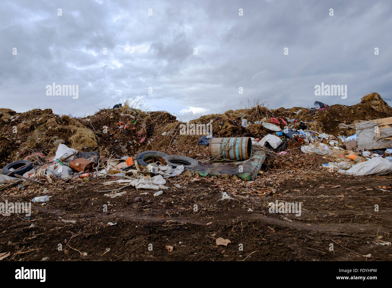 Disposed garbage polluting environment near a village in Transyilvania ...