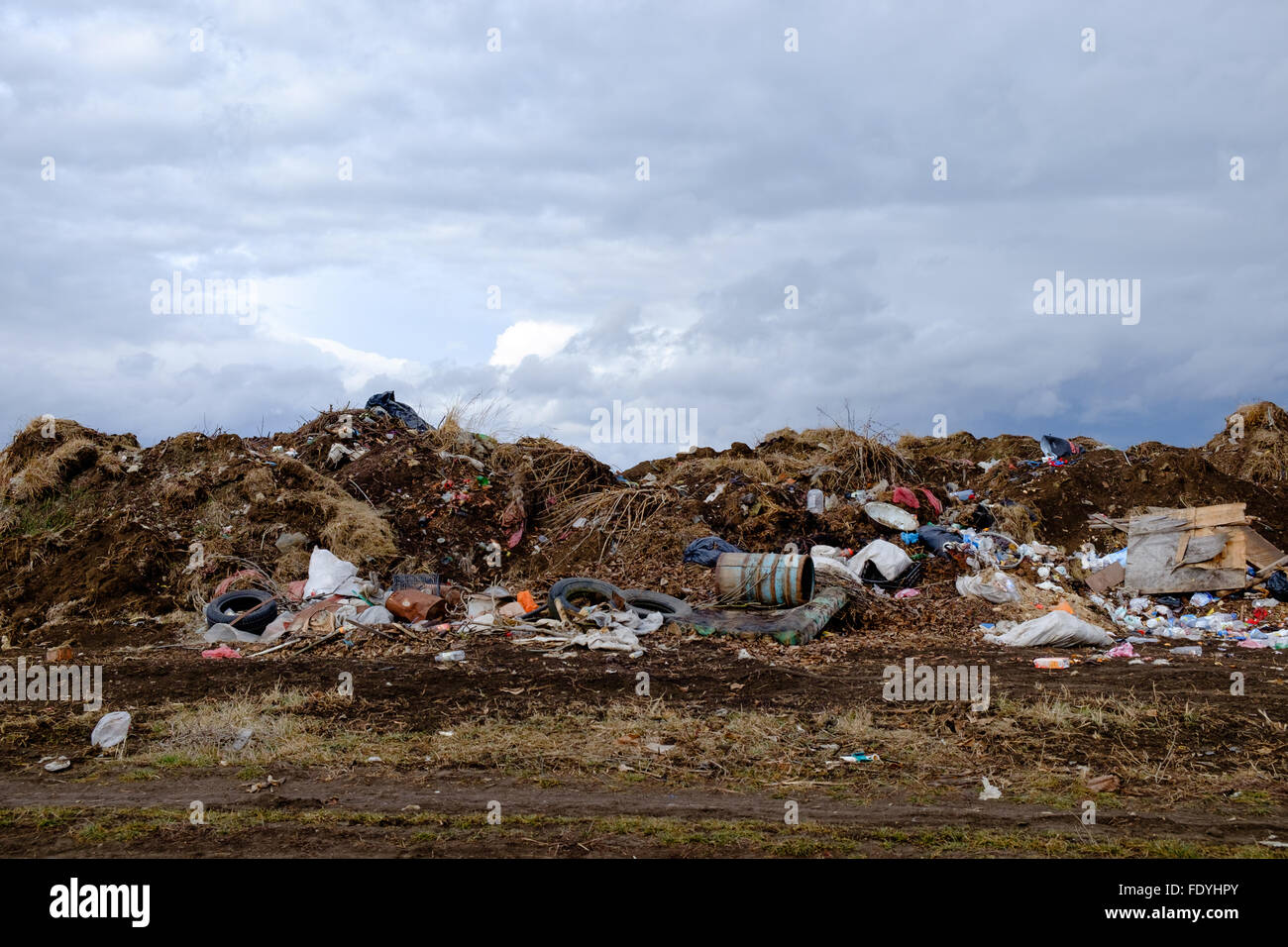 Disposed garbage polluting environment near a village in Transyilvania ...