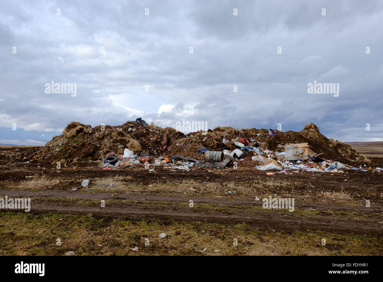 Disposed garbage polluting environment near a village in Transyilvania ...