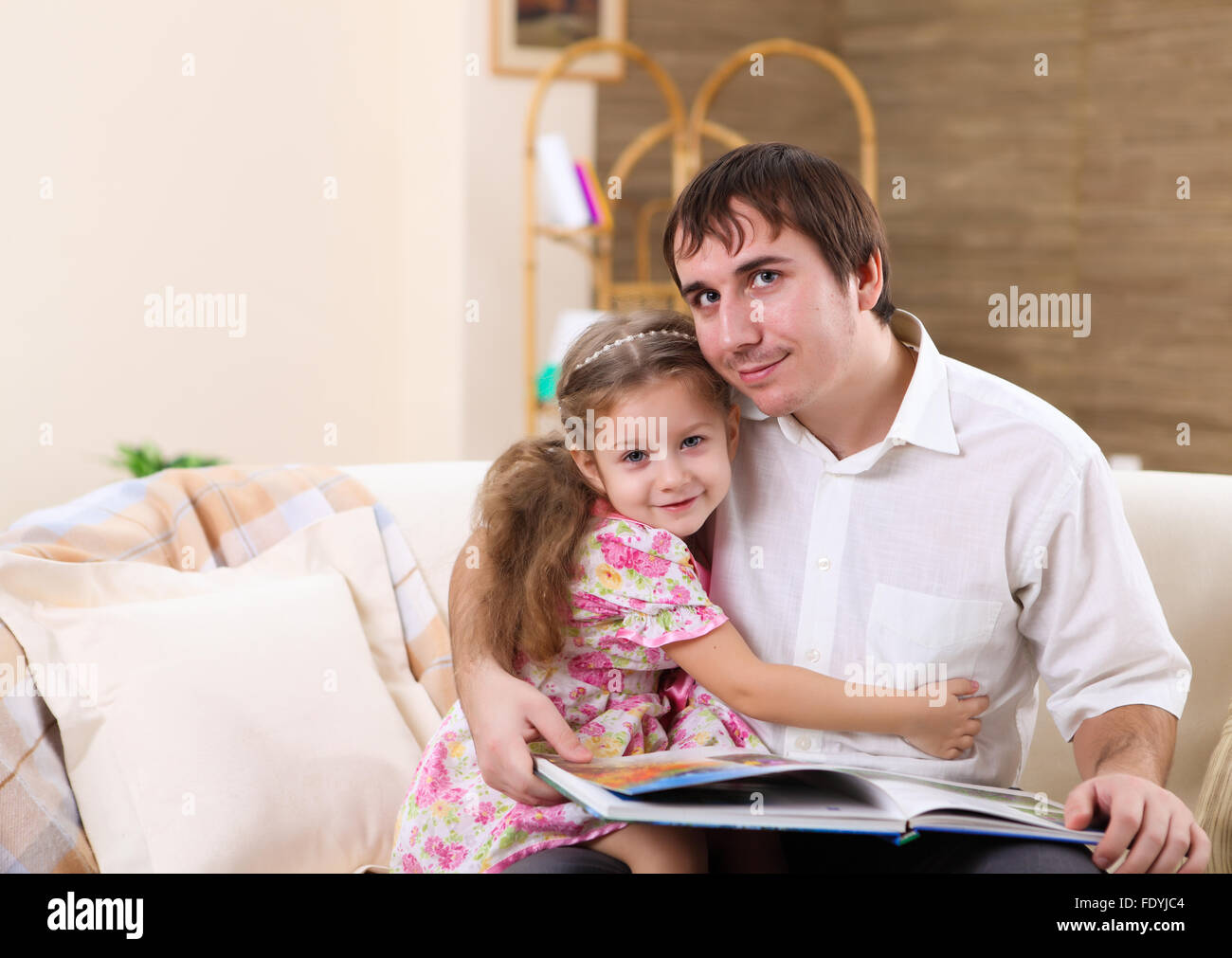 young father with a daughter at home in the living-room Stock Photo - Alamy