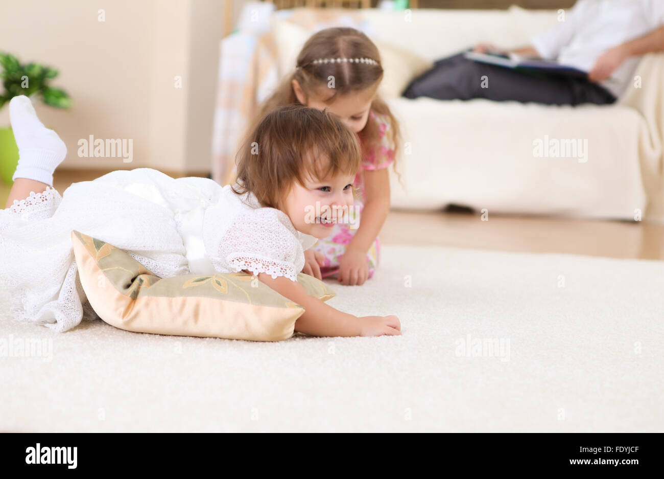 an older sister playing with a toddler sister at home Stock Photo - Alamy