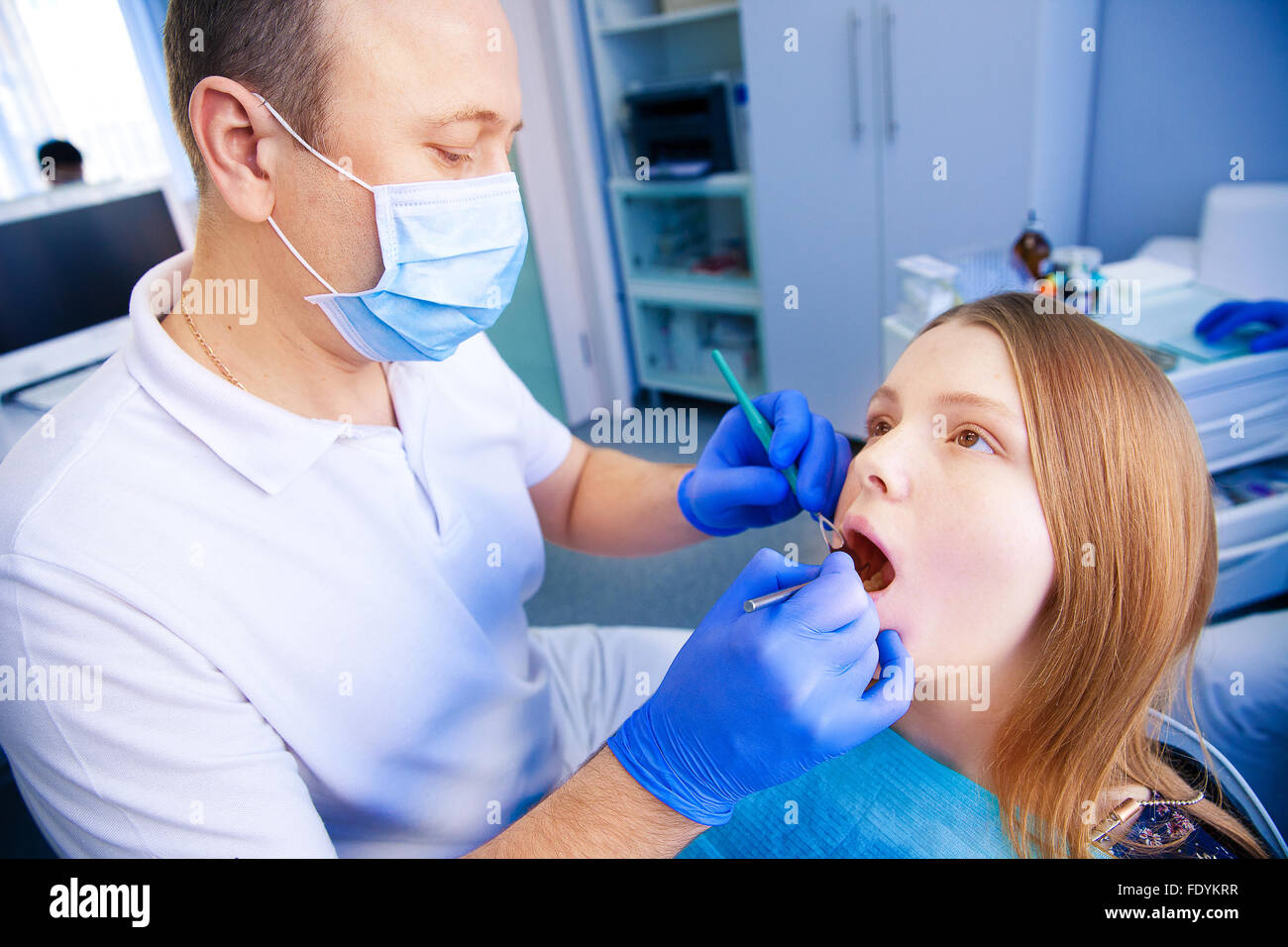 dentist treats teeth Stock Photo - Alamy