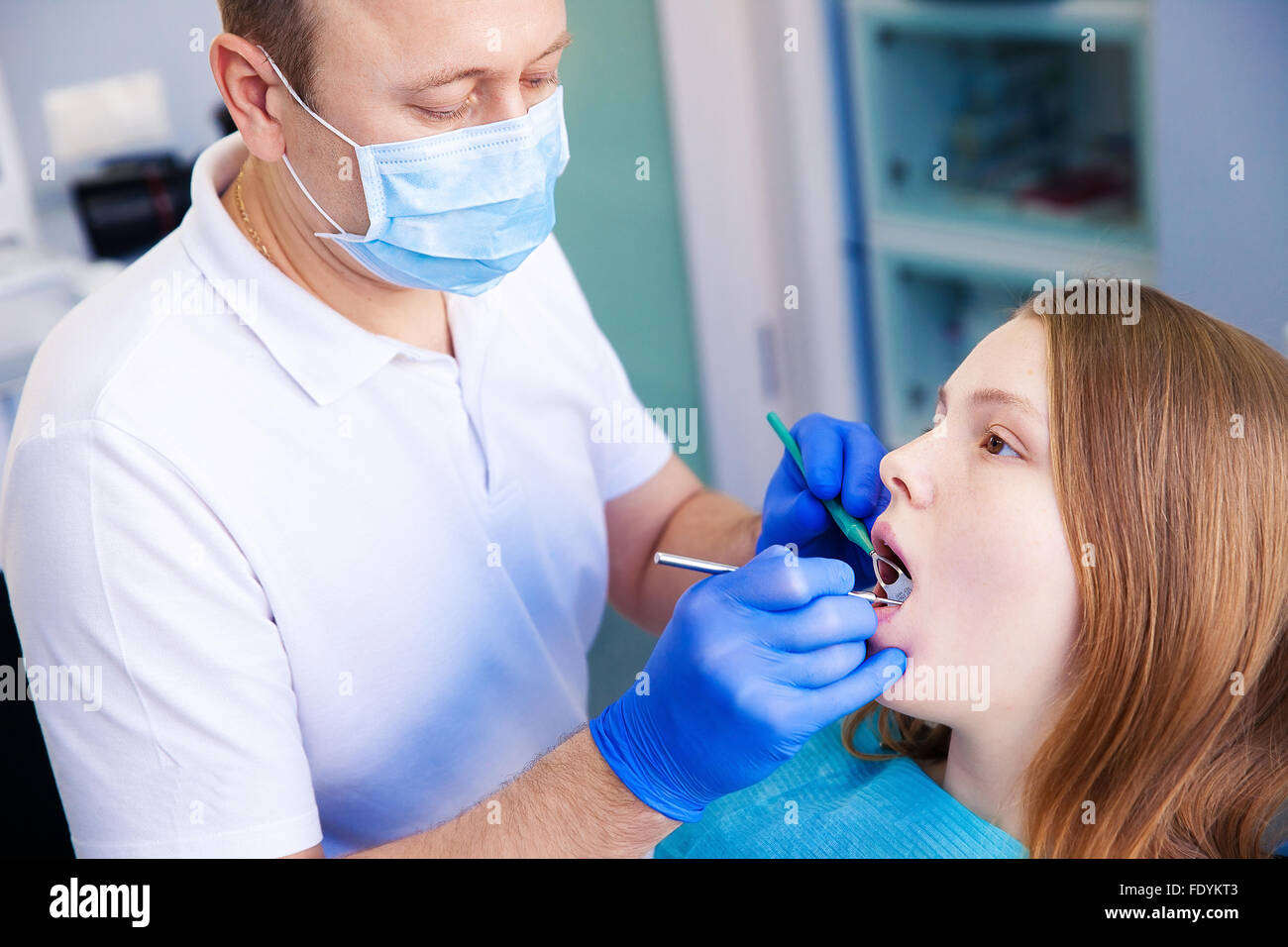 dentist treats teeth Stock Photo - Alamy