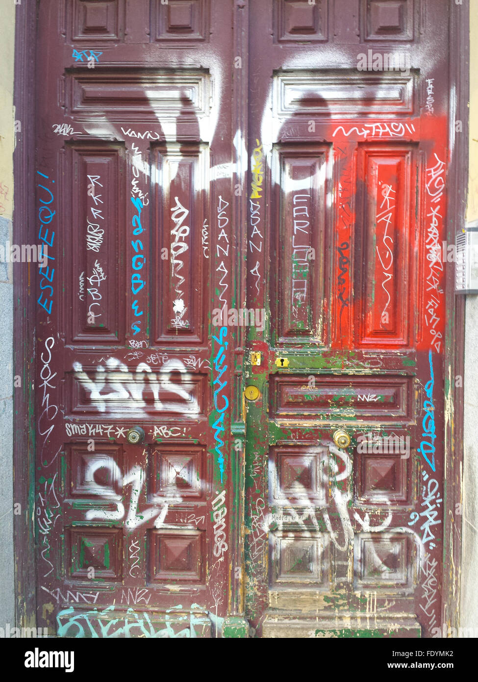 Wooden door full of graffiti Stock Photo - Alamy