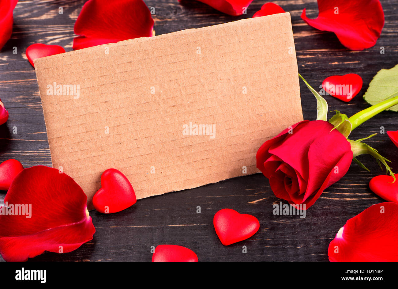 Blank valentine card, hearts and scattered rose petals Stock Photo - Alamy