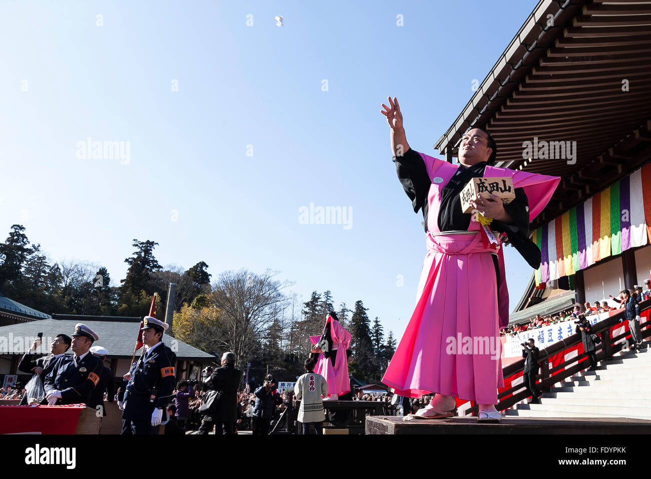 Sumo wrestler Ozeki Kisenosato throws beans during a Setsubun festival ...