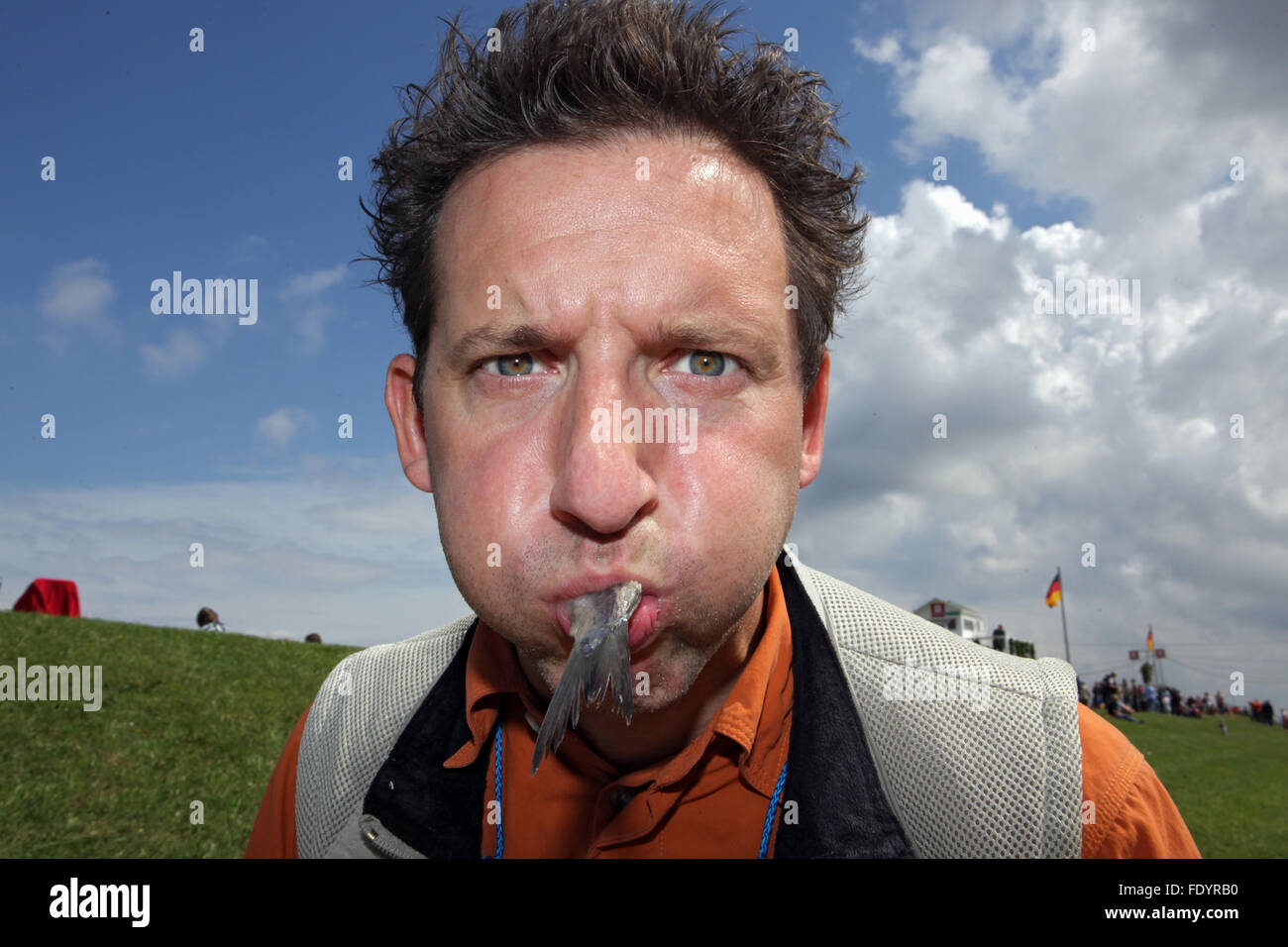 Cuxhaven, Germany, man has eaten too much fish Stock Photo - Alamy
