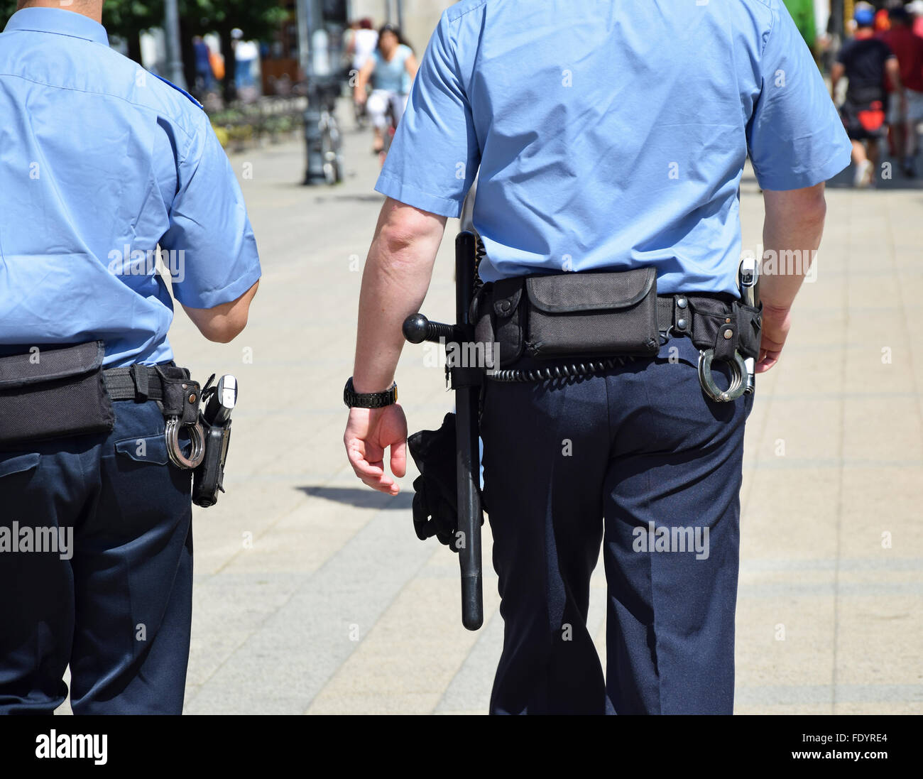 Police officers on the street Stock Photo - Alamy