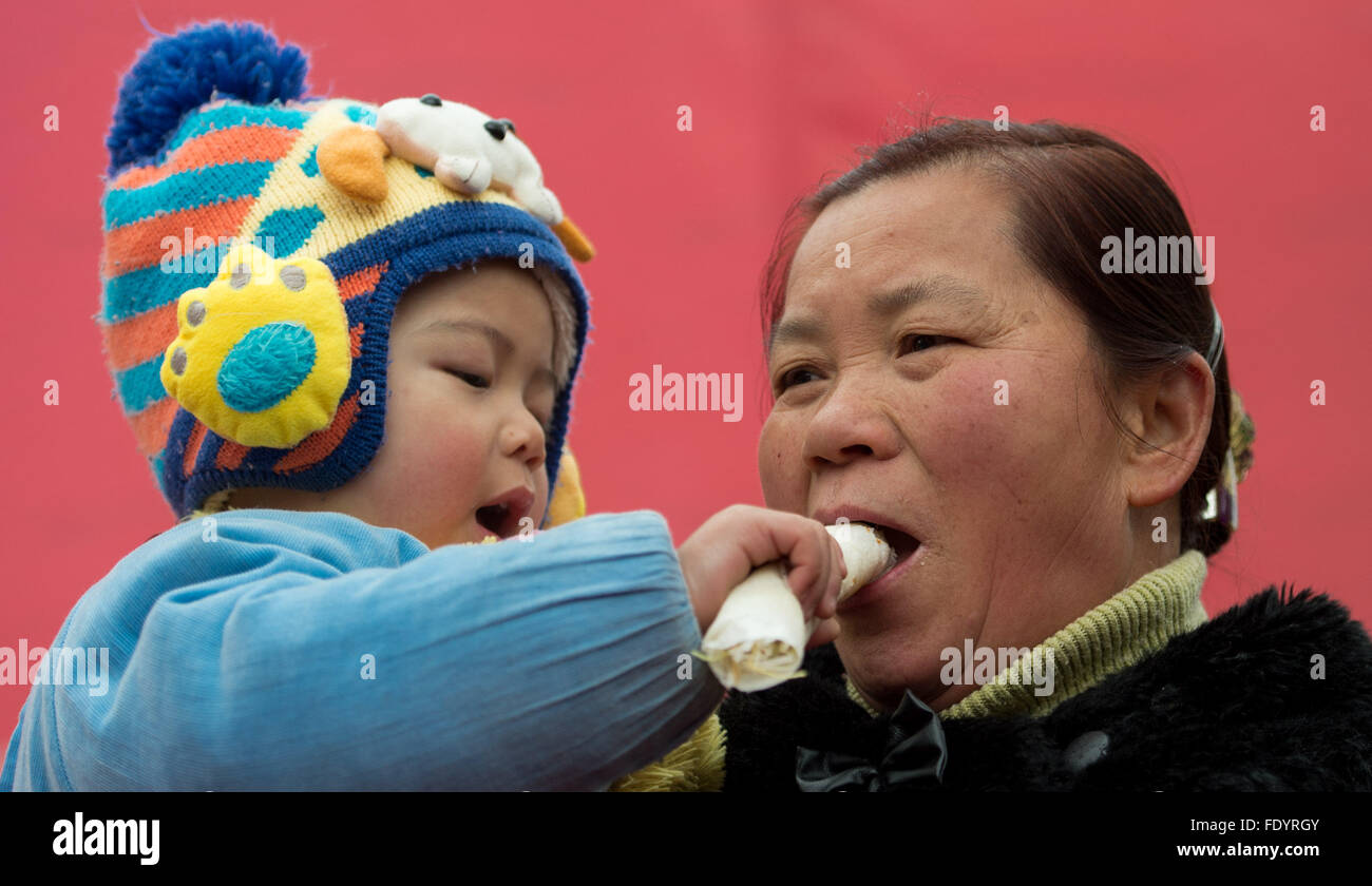 Chengdu, China's Sichuan Province. 3rd Feb, 2016. People eat "spring ...