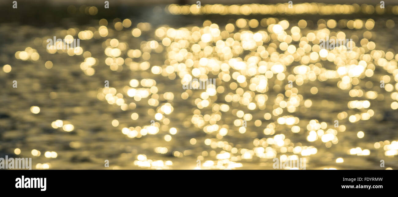 background with reflected lights over water Stock Photo - Alamy