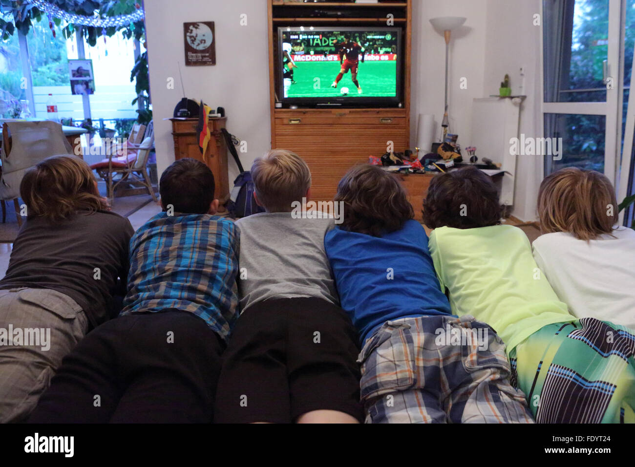 Teens watching football game hi-res stock photography and images - Alamy