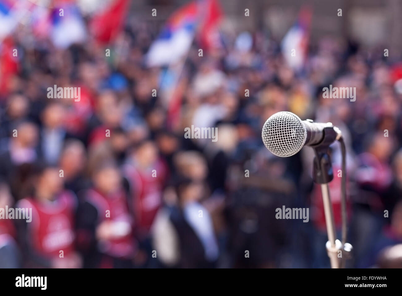 Microphone in focus against unrecognizable crowd Stock Photo - Alamy