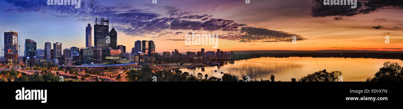 wide sunrise panorama of Perth CBD cityscape with swan river reflecting ...