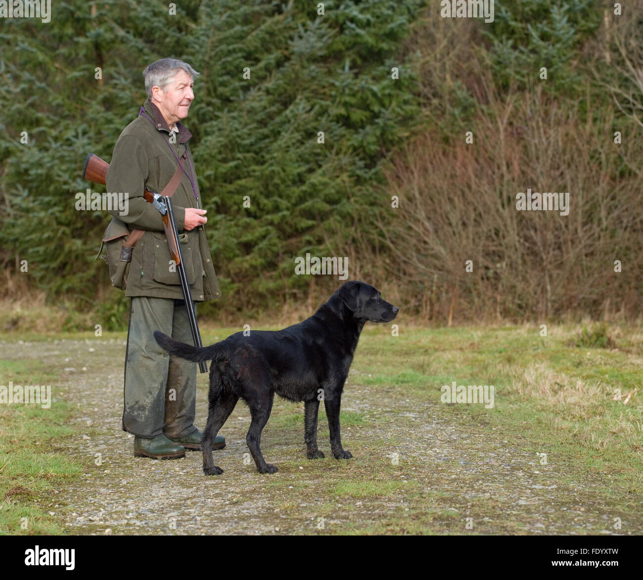 Man with black labrador hi-res stock photography and images - Alamy