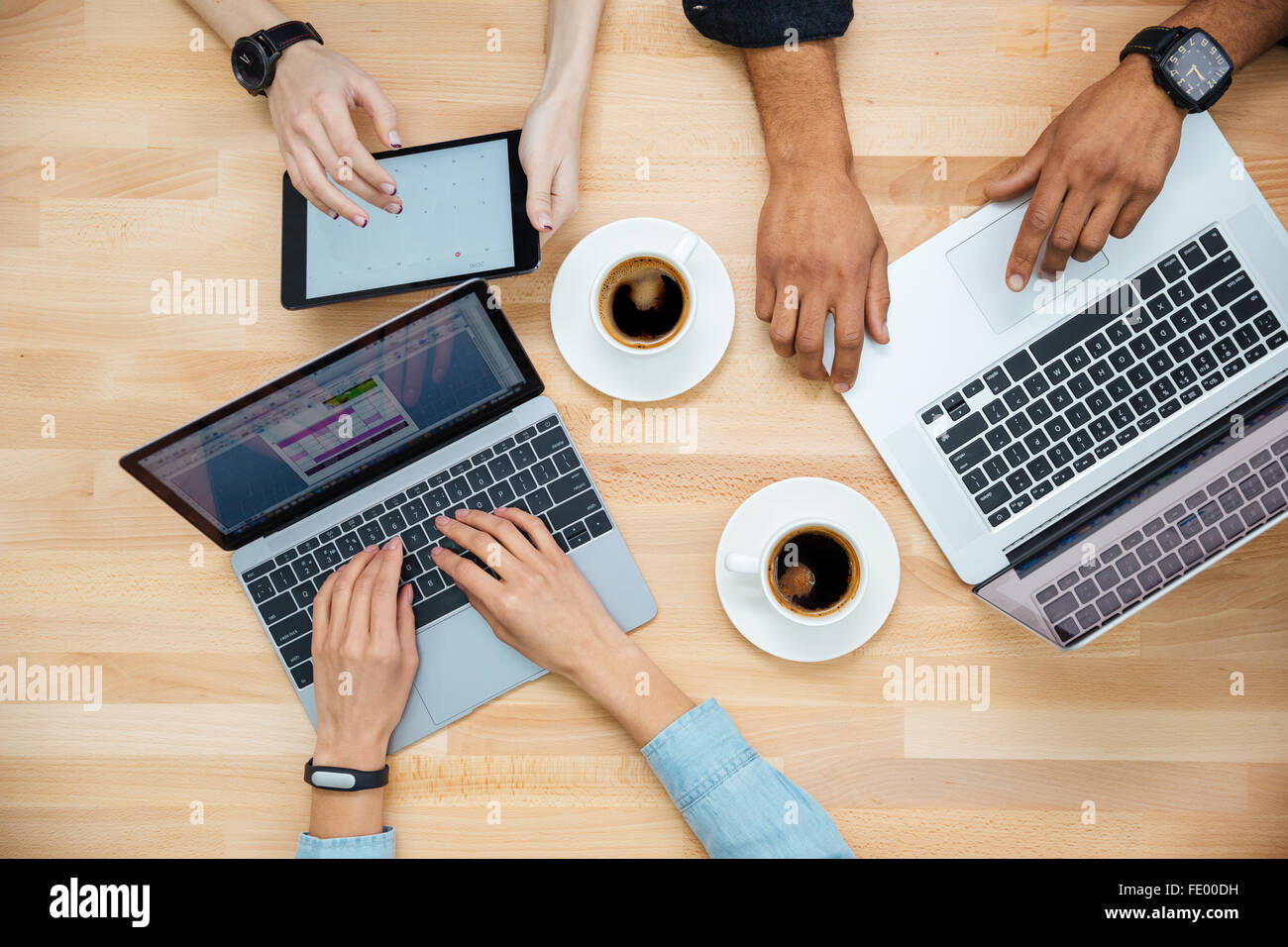 Multiethnic group using laptops hi-res stock photography and images - Alamy