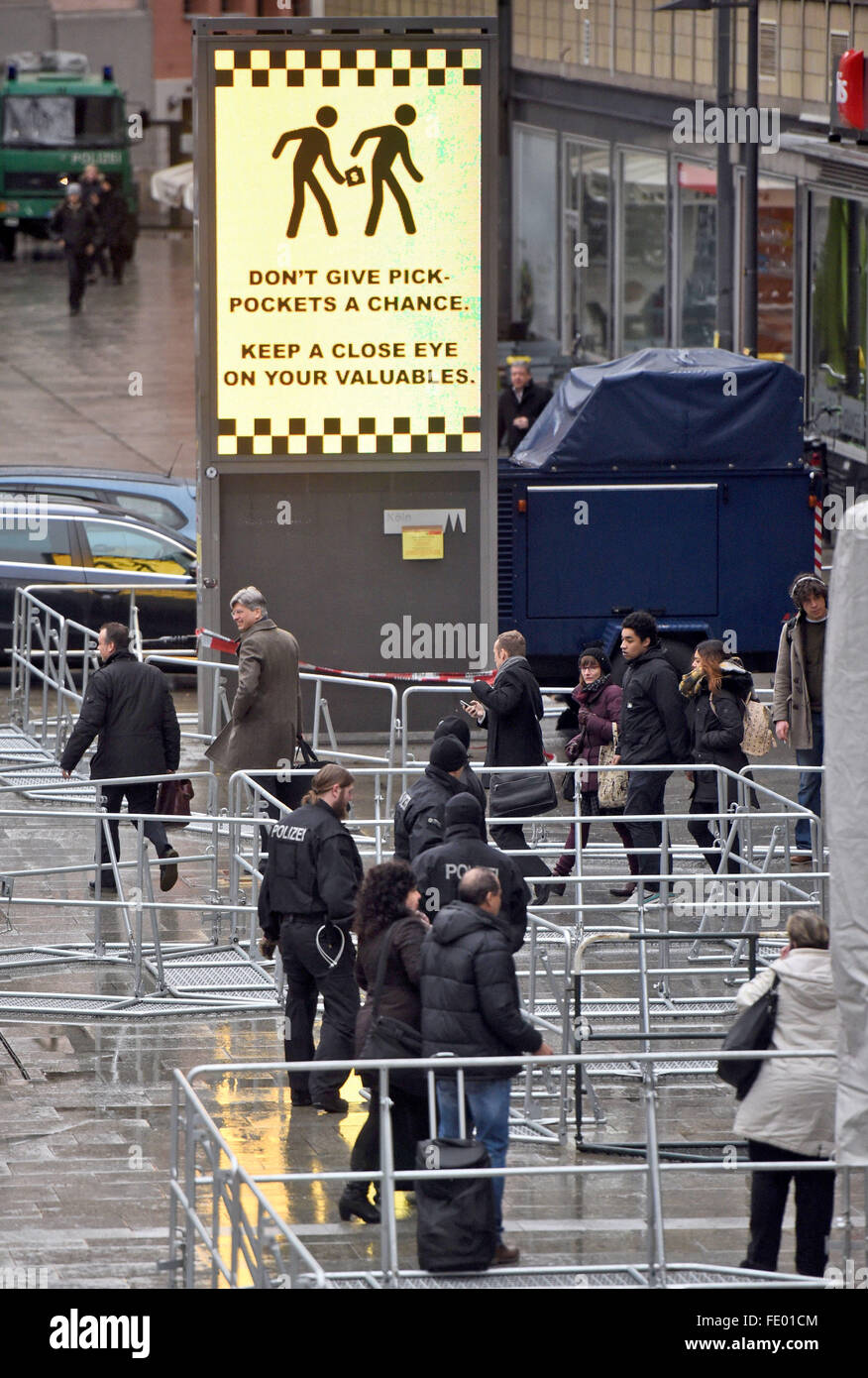 Police officers set up security barricades on the plaza in front of the ...