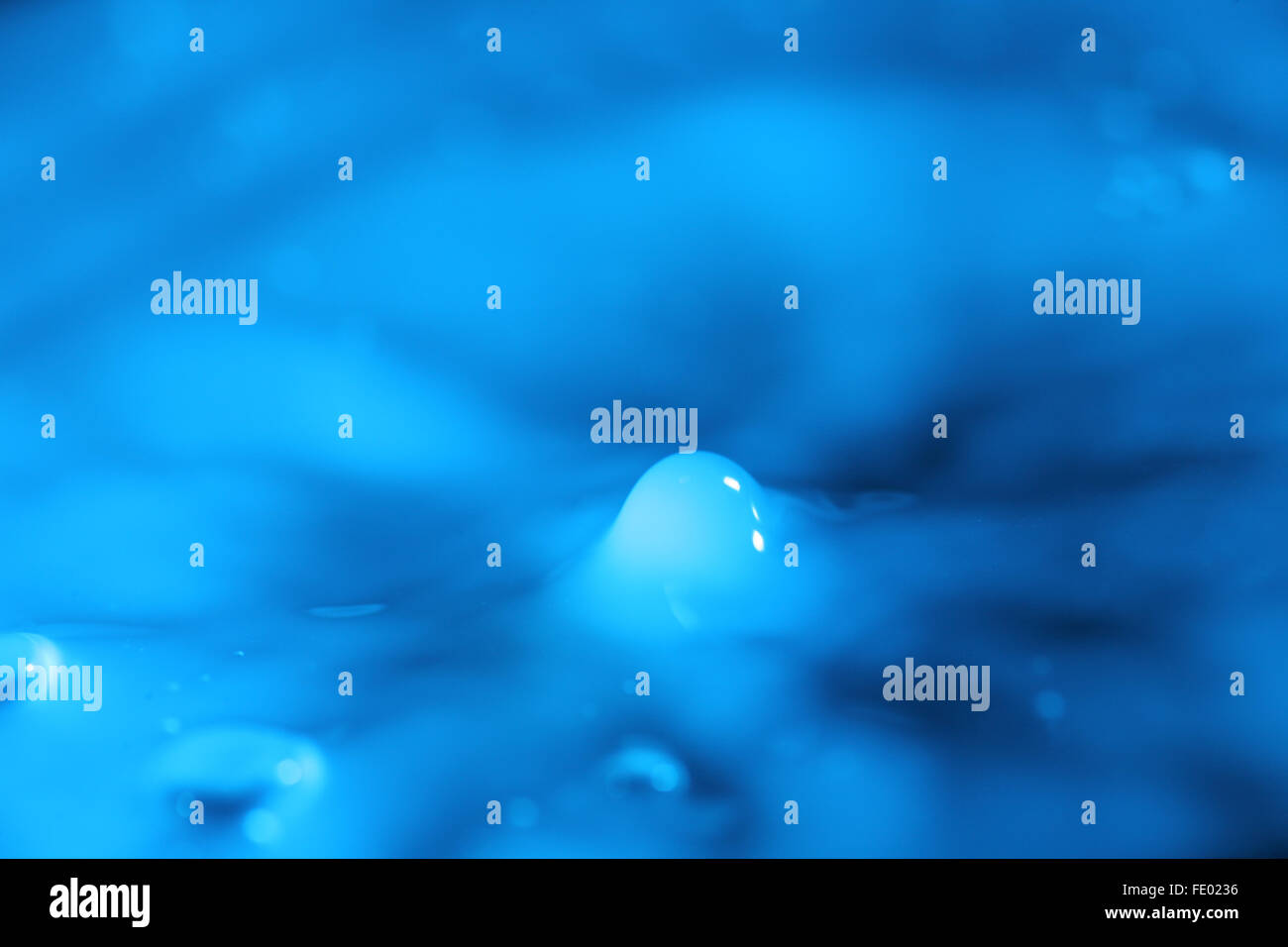 Water drop fall on surface defocused image Stock Photo - Alamy
