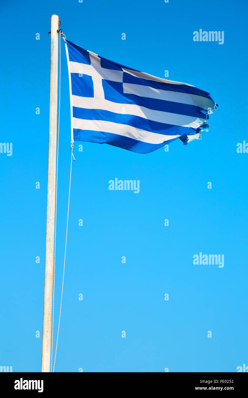 waving greece flag in the blue sky and flagpole Stock Photo - Alamy