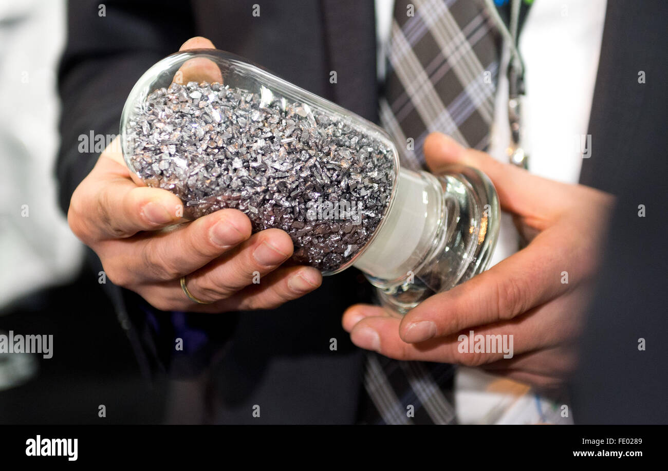 A man holds up a sample of the rare metal tungsten in the procedural ...