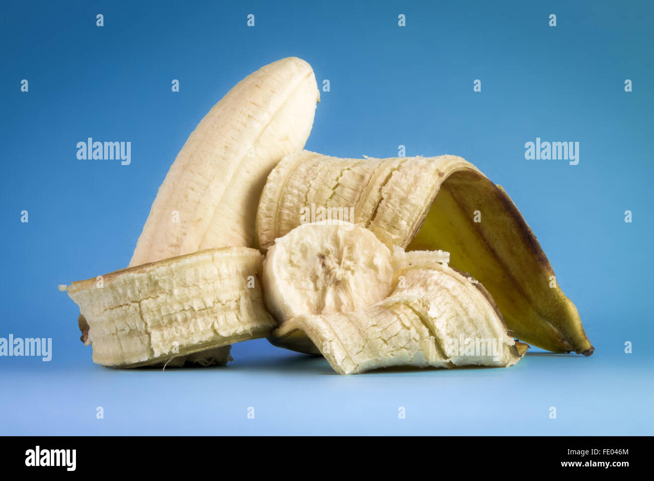 Banana on blue background Stock Photo - Alamy