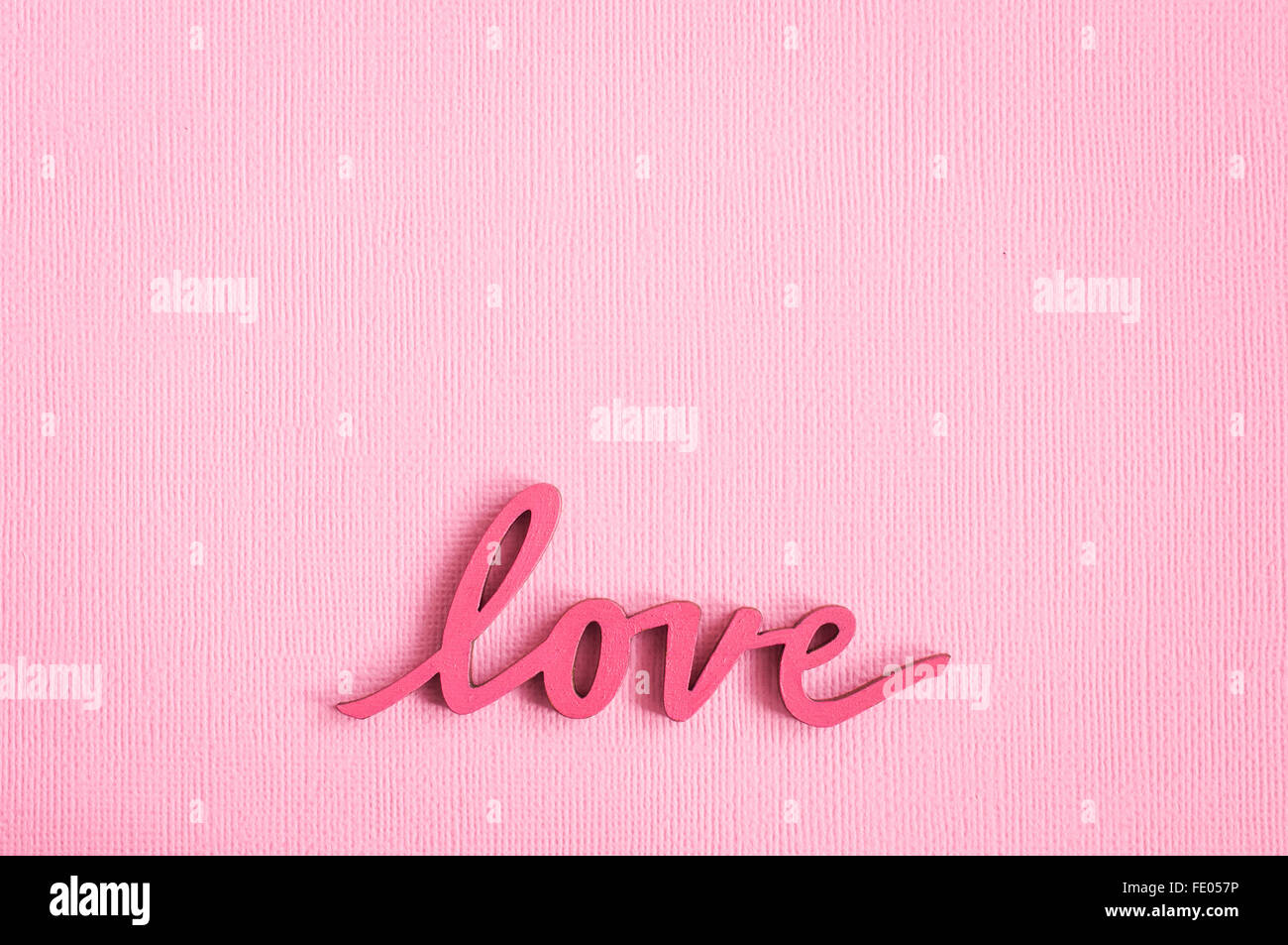 Pink paper background with word "love Stock Photo - Alamy