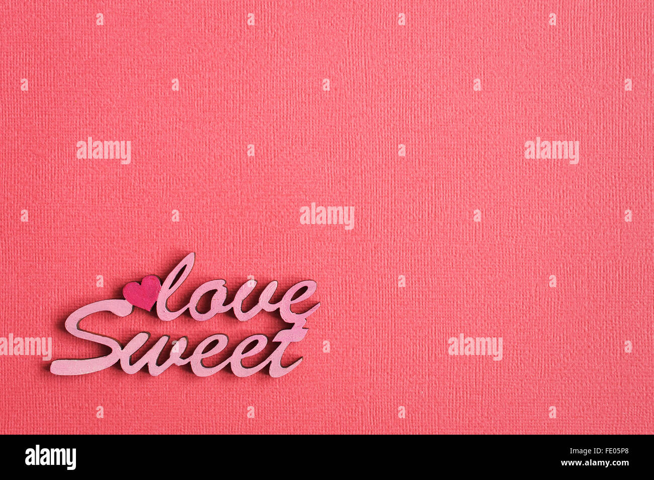 Pink paper background with words "love sweet Stock Photo - Alamy