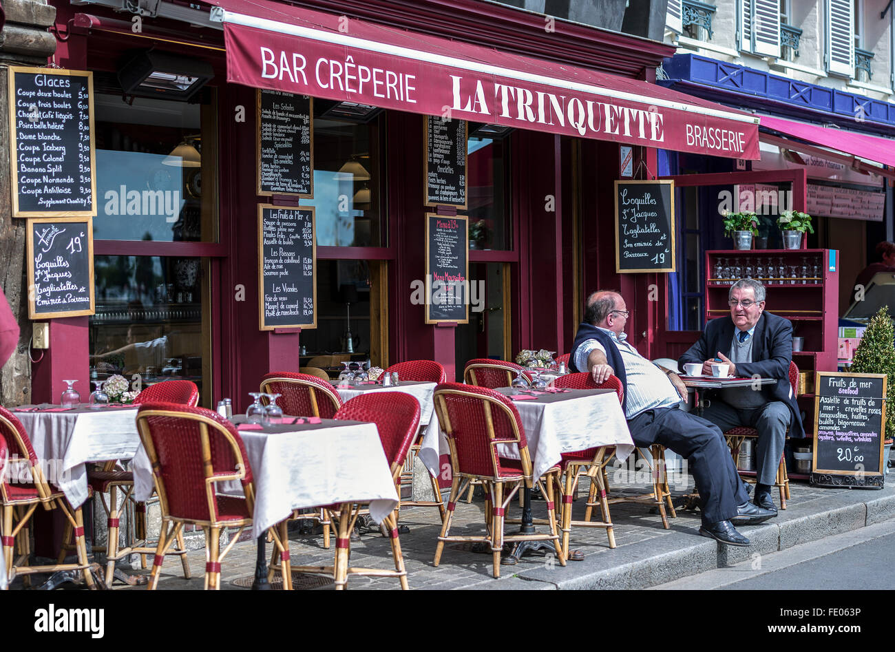 France, Normandy, Honfleur, a bar creperie in the old harbor basin ...