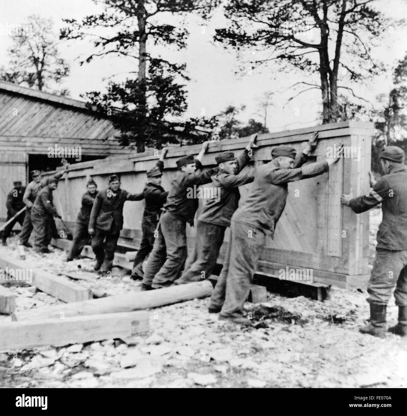 The Nazi propaganda picture shows the construction of a bridge through ...